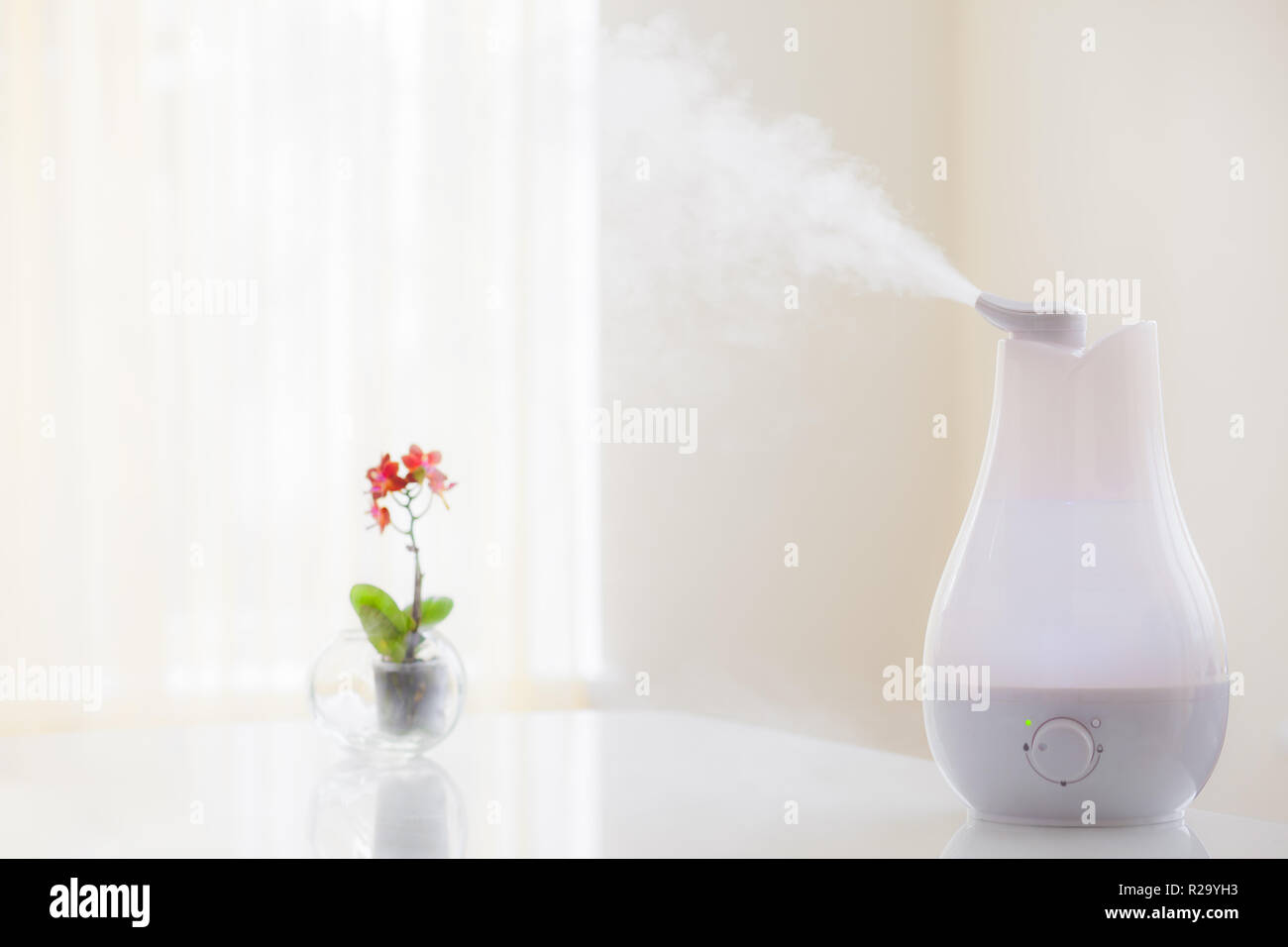 Humidifier spreading steam into the living room Stock Photo - Alamy