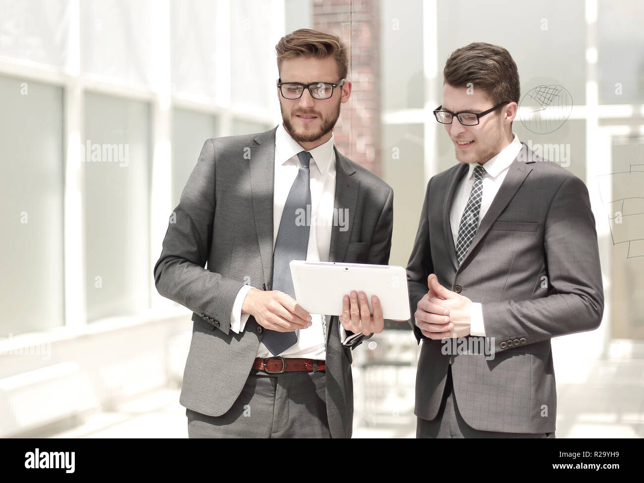 two employees standing in the office Stock Photo - Alamy