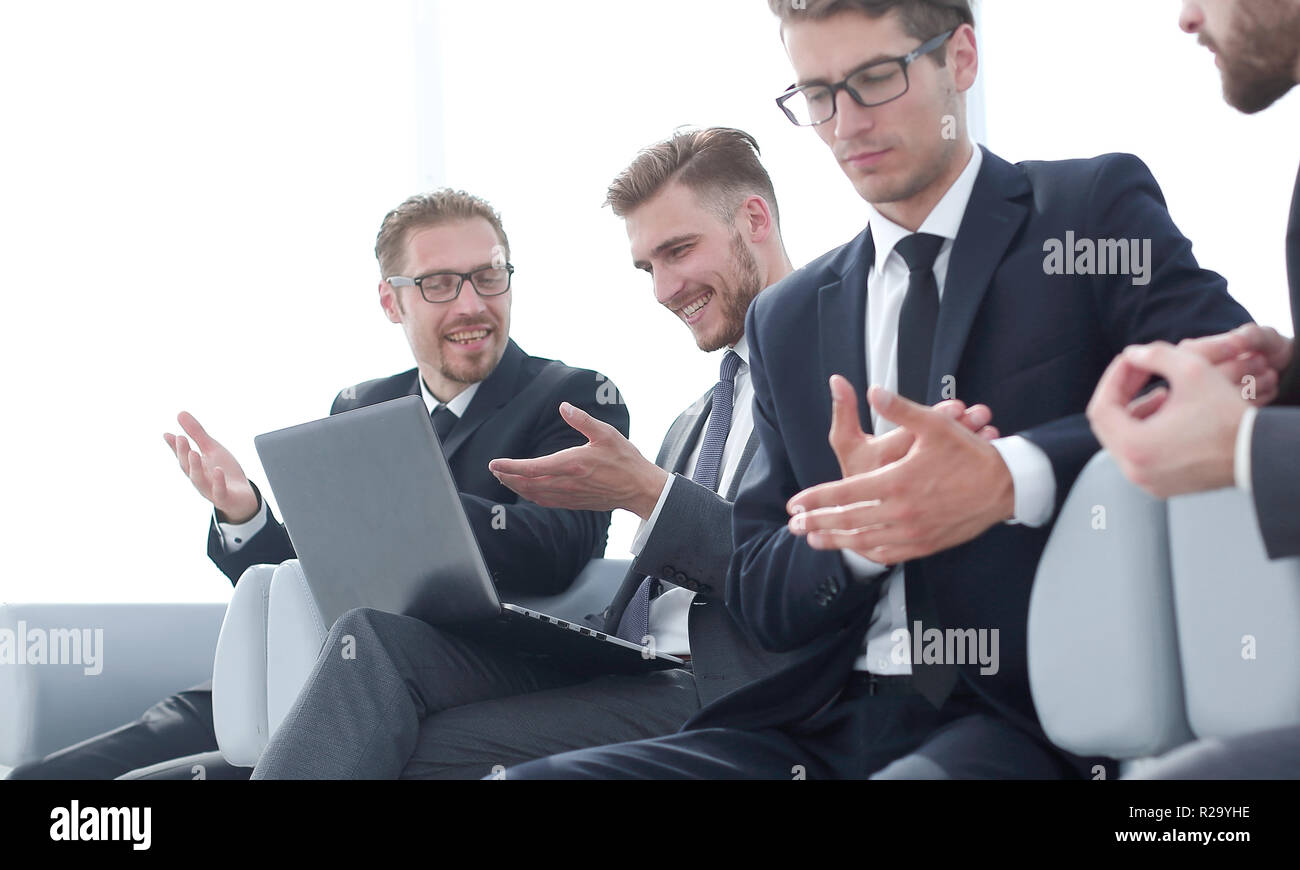 group of business people talking sitting in the office waiting room ...