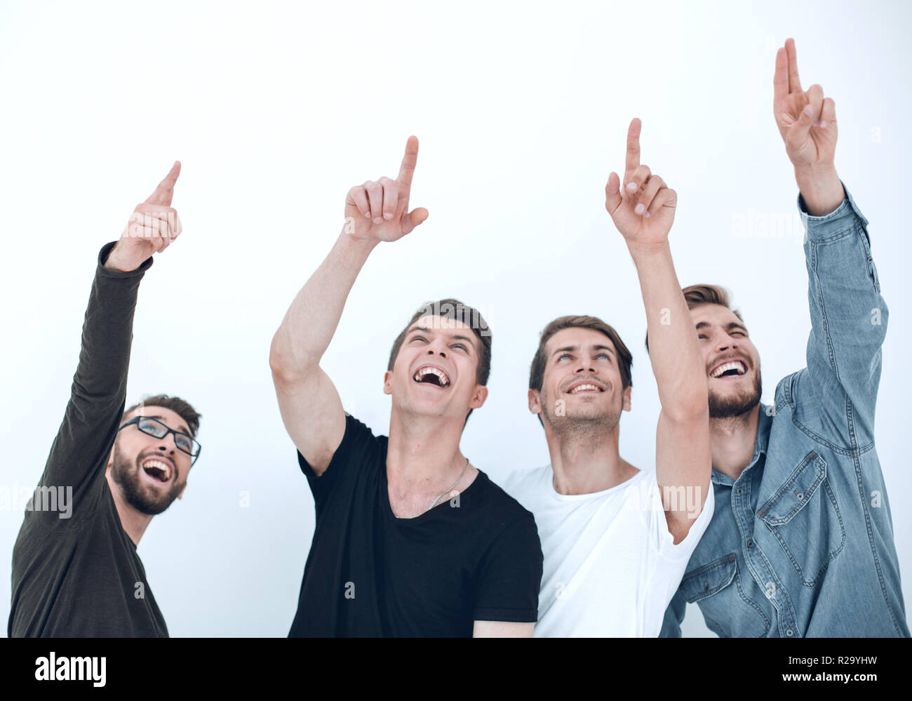 A group of people raises their hands up and points Stock Photo - Alamy
