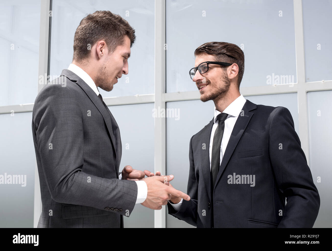 two businessmen posing Stock Photo - Alamy