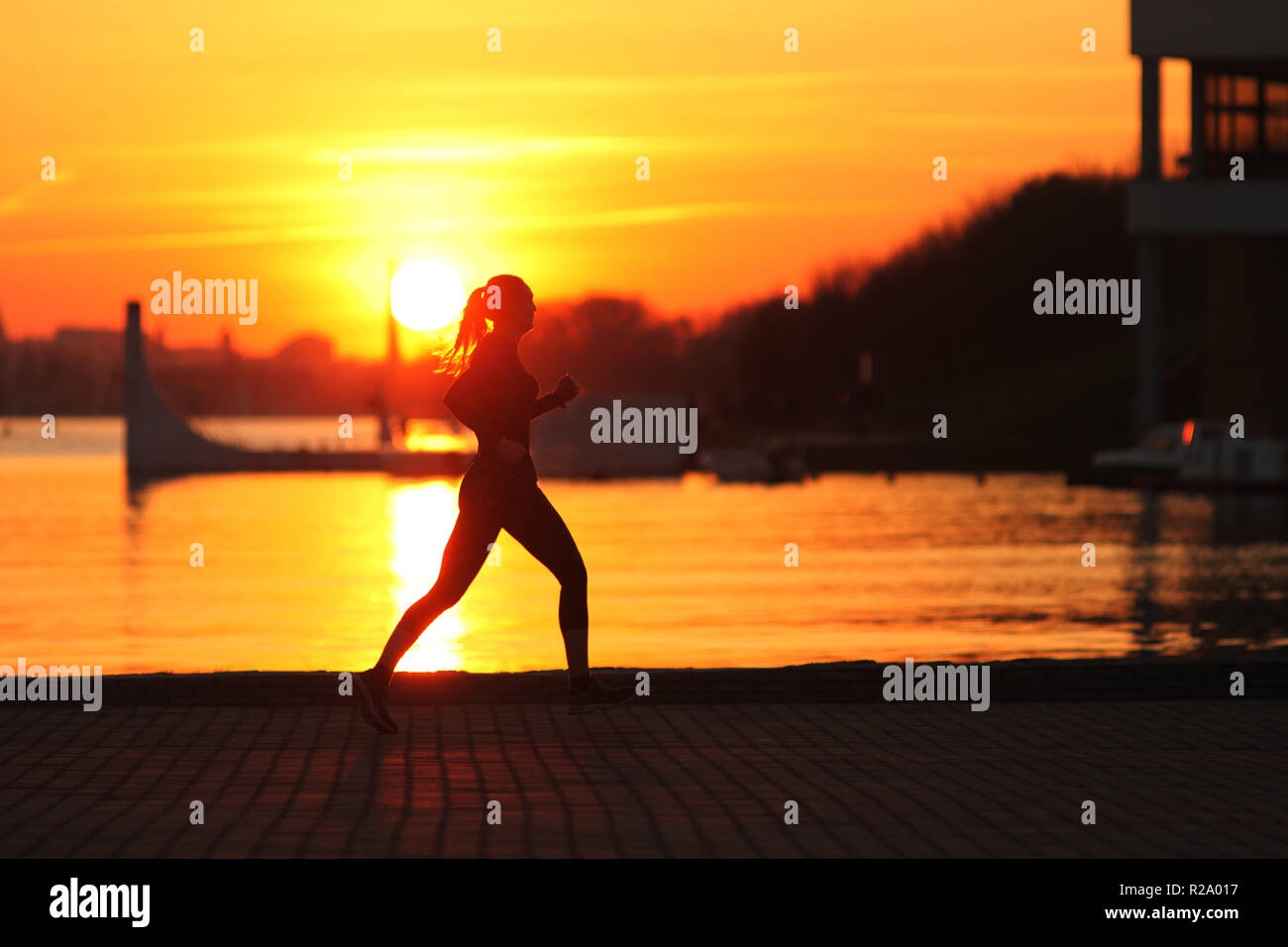 Girl in silhouette running on hi-res stock photography and images - Alamy