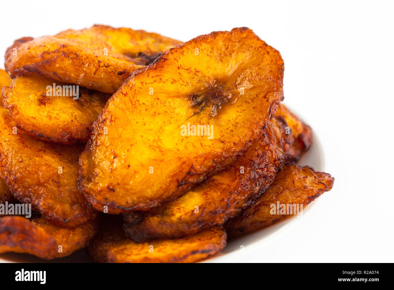 Deep fried ripe plantain slices isolated in white background Stock ...