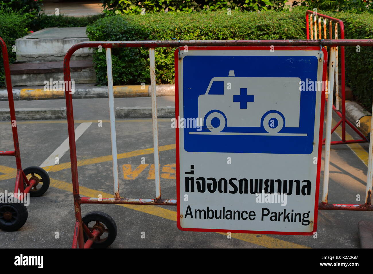 closeup of ambulance parking sign in both thai and english languages in ...