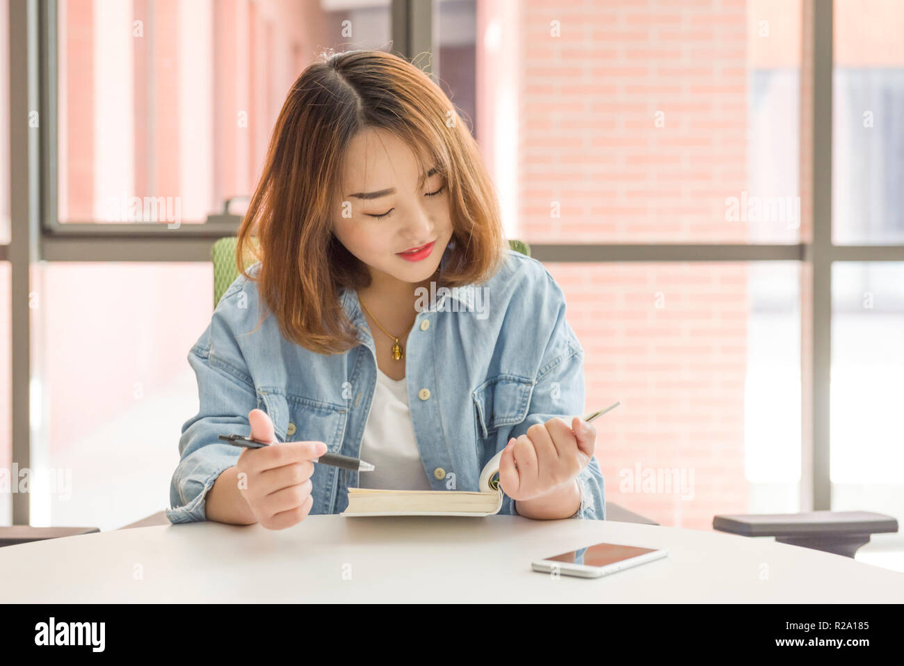 Asian student studying. A portrait of college student at campus Stock ...