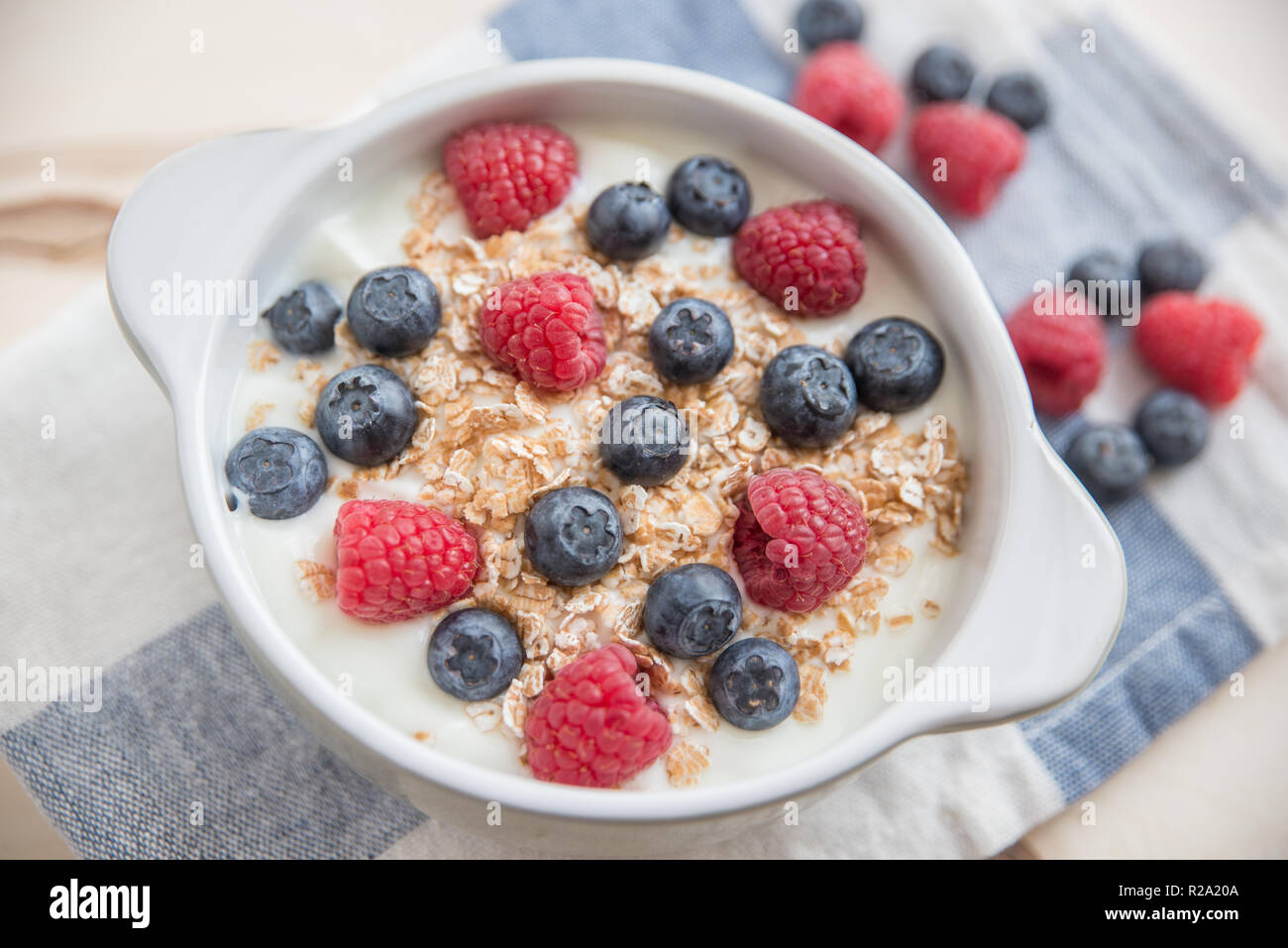 Yoghurt with berries and granola Stock Photo - Alamy
