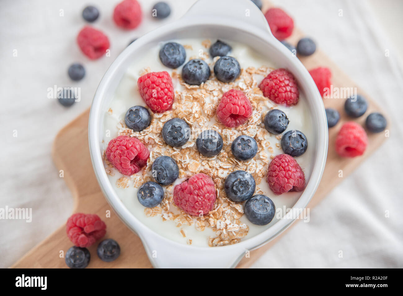 Yoghurt with berries and granola Stock Photo - Alamy