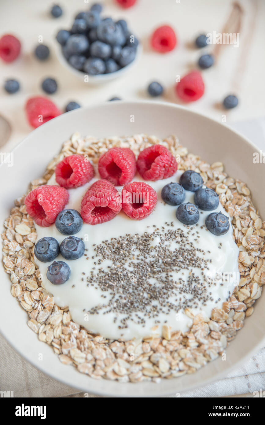Yoghurt with berries and granola Stock Photo - Alamy