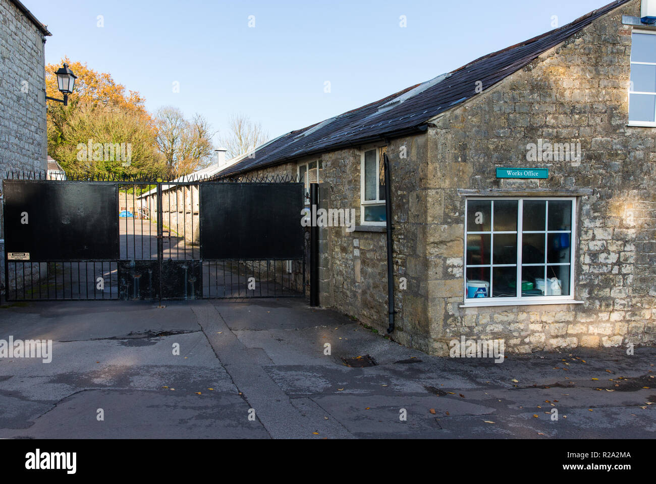Downside Abbey; view of works office building and sign Stock Photo - Alamy