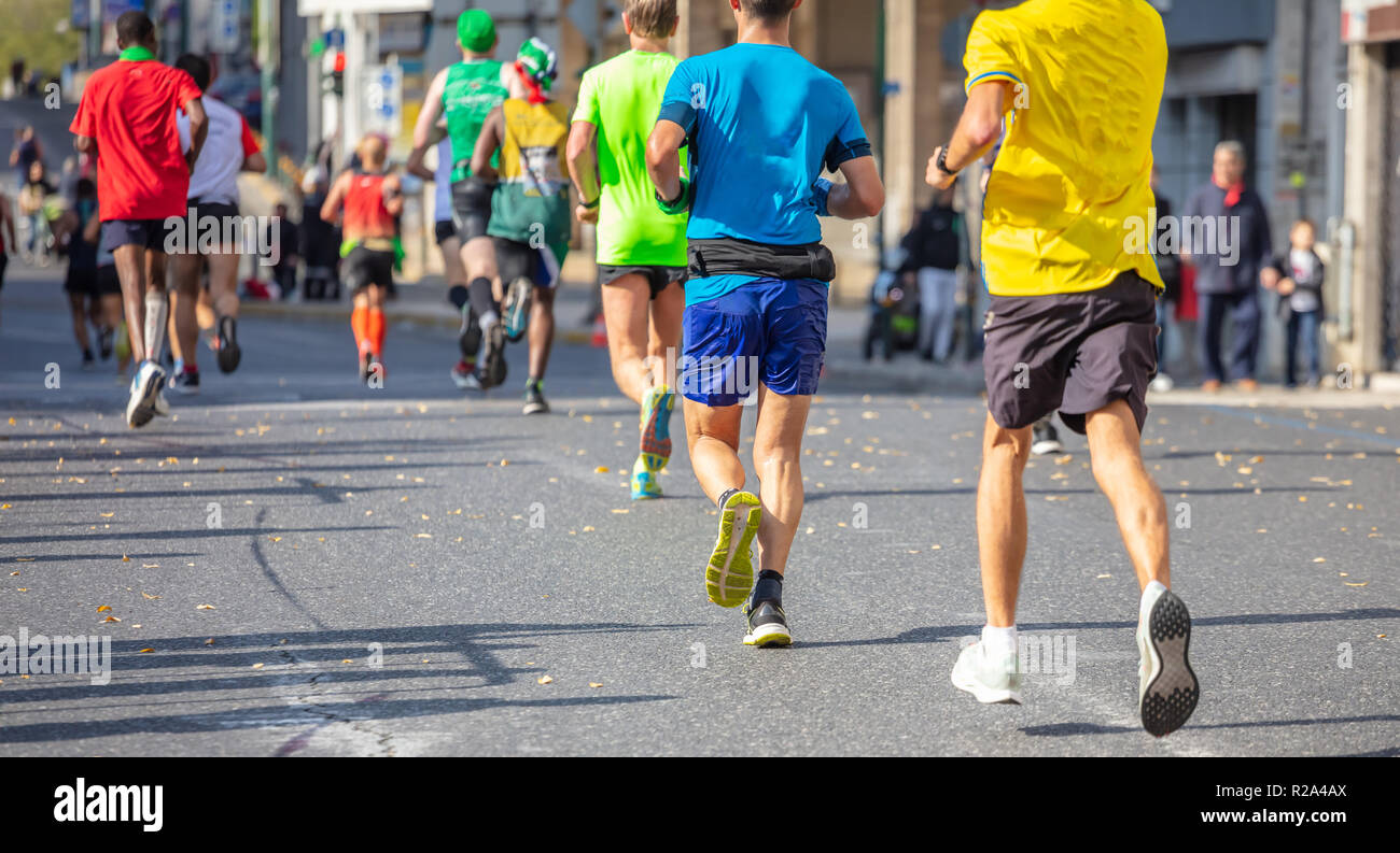 Marathon running race, group of runners on city roads, back view Stock ...