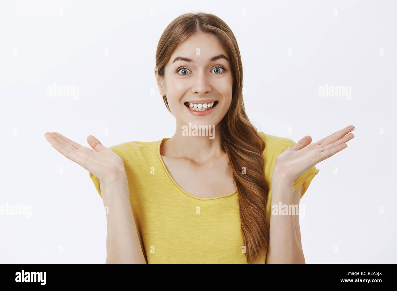 Waist Up Shot Of Calm And Carefree Happy Clueless Young Woman In T