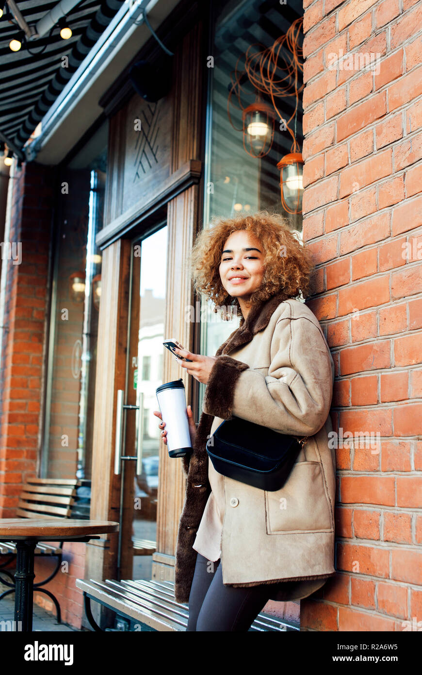 young pretty african american women drinking coffee outside in c Stock ...