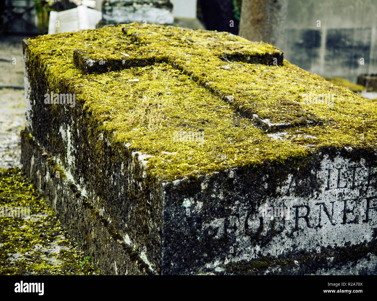 Tombstones in cemetery at dusk, gothic style crosses noone Stock Photo ...