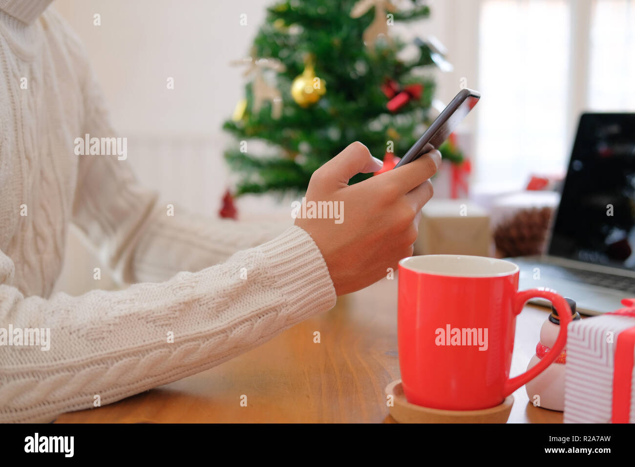 man using smartphone at home. woman texting message on mobile phone ...