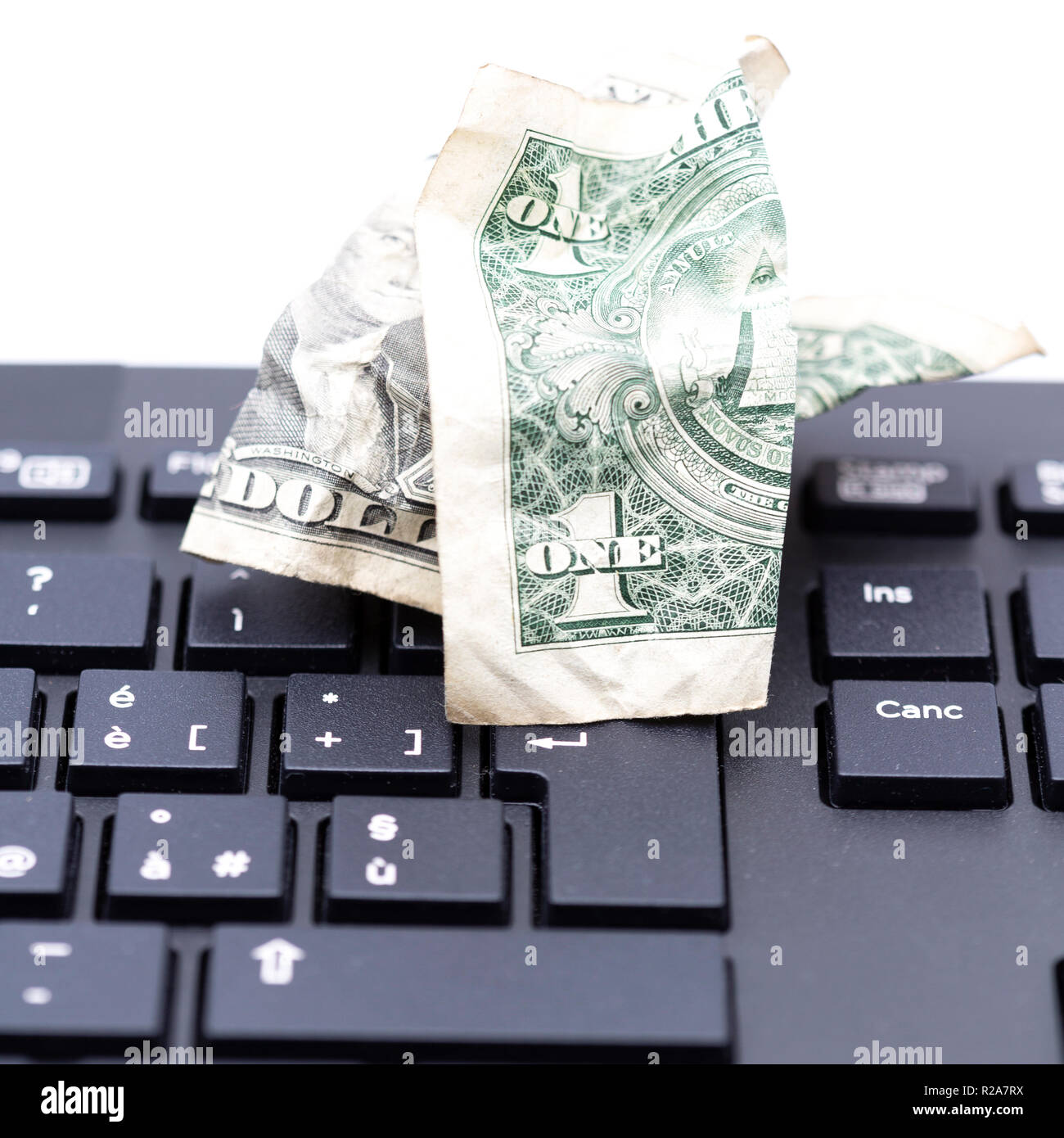 blurred crumpled dollar money background in a keyboard like concept of ...
