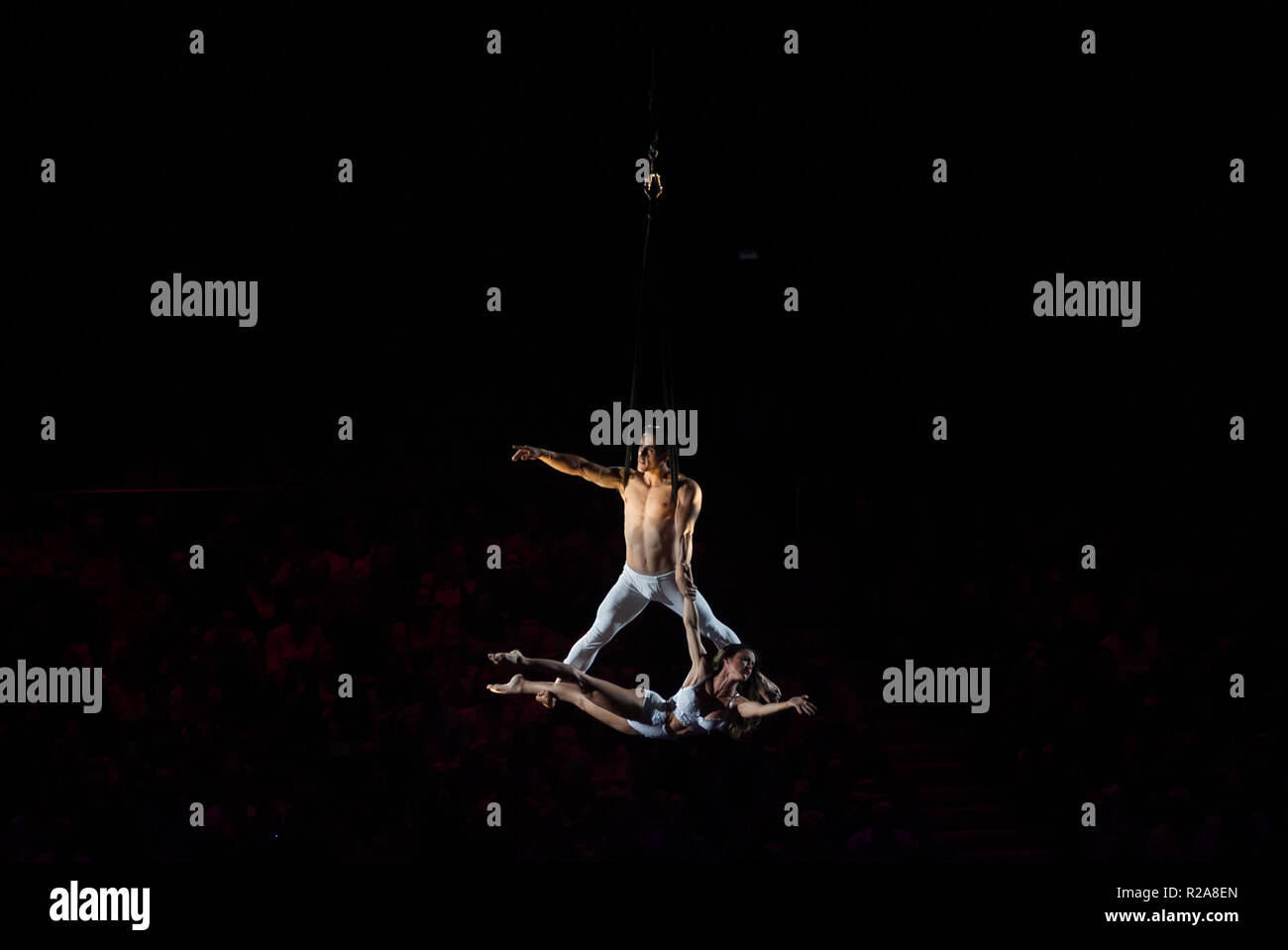 Acrobats seen performing in the air during the Revolution on Ice Tour ...