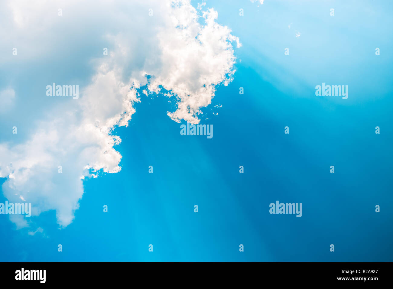 Blur sky and rays of light shining down with clouds atmospheric effect ...