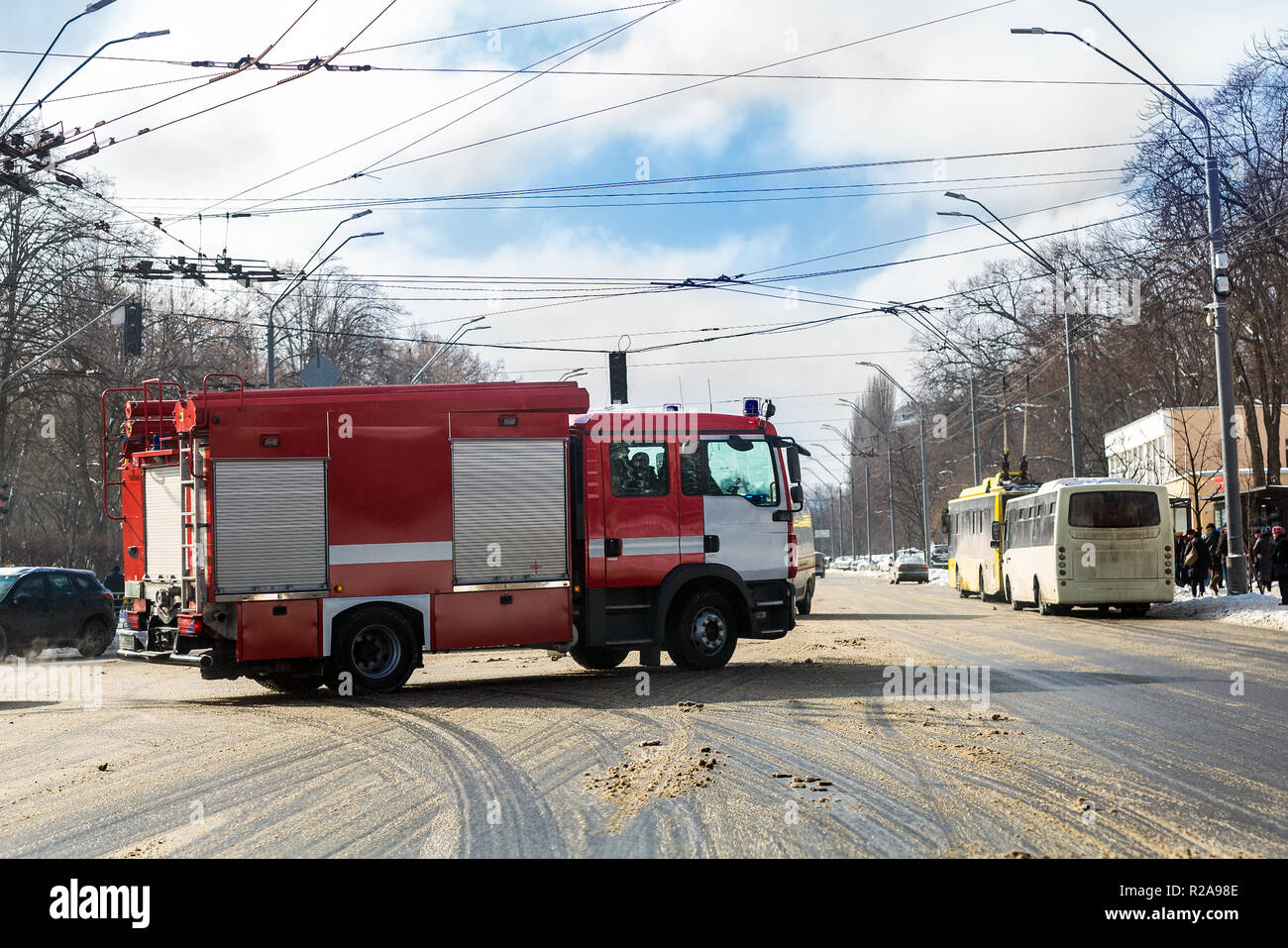 Firetruck racing through city street on slippery road at winter Stock ... Firetruck racing through city street on slippery road at winter Stock ...