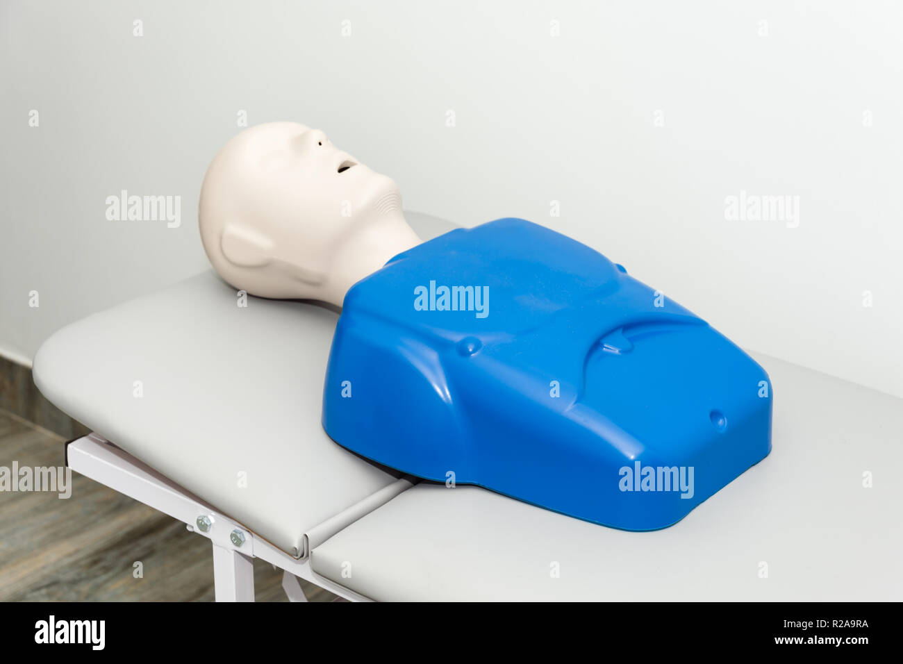 Hospital training dummy on hospital bed with mouth open. Horizontal ...