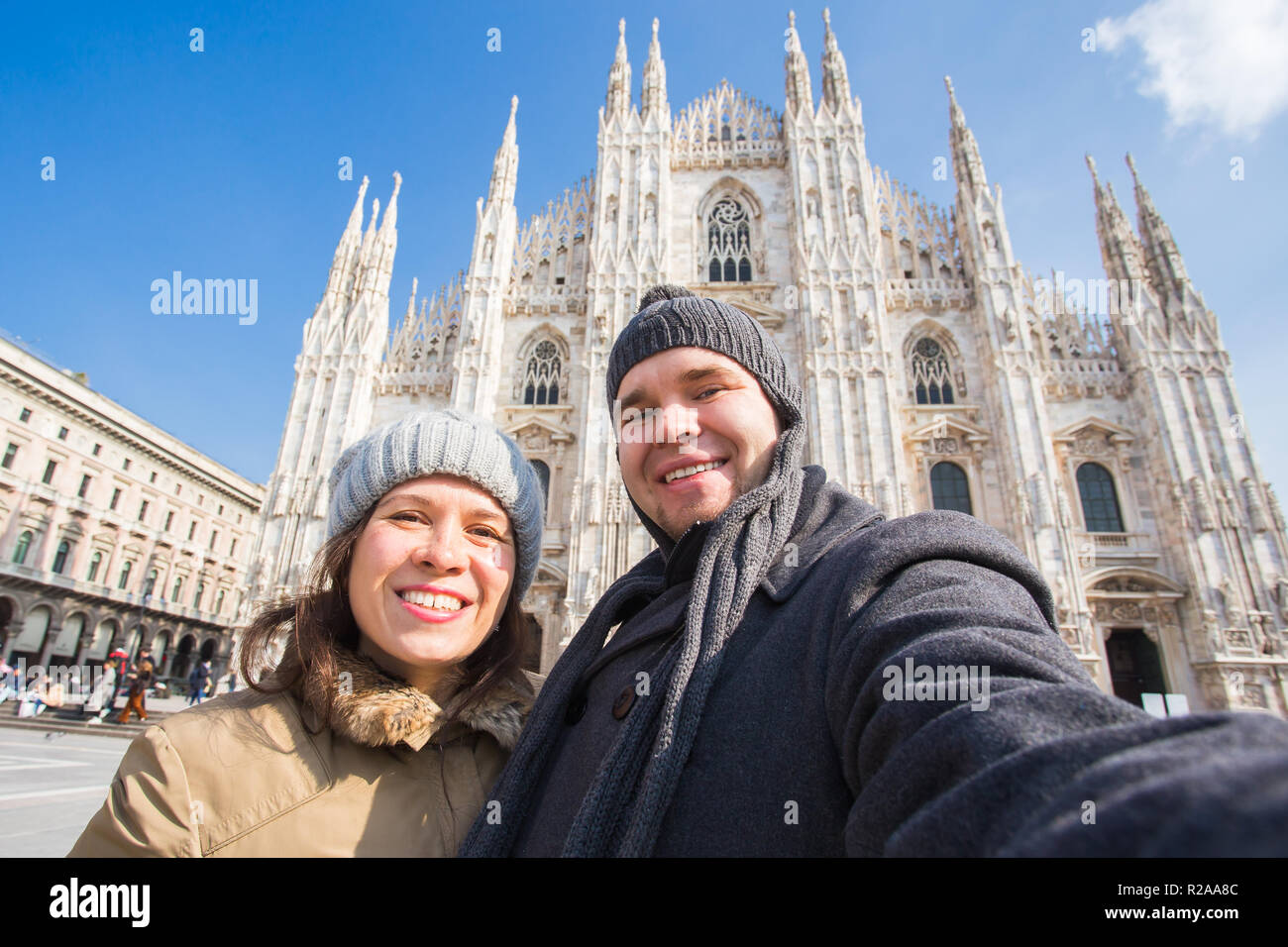 Couple taking self portrait in Duomo square in Milan. Winter holidays ...