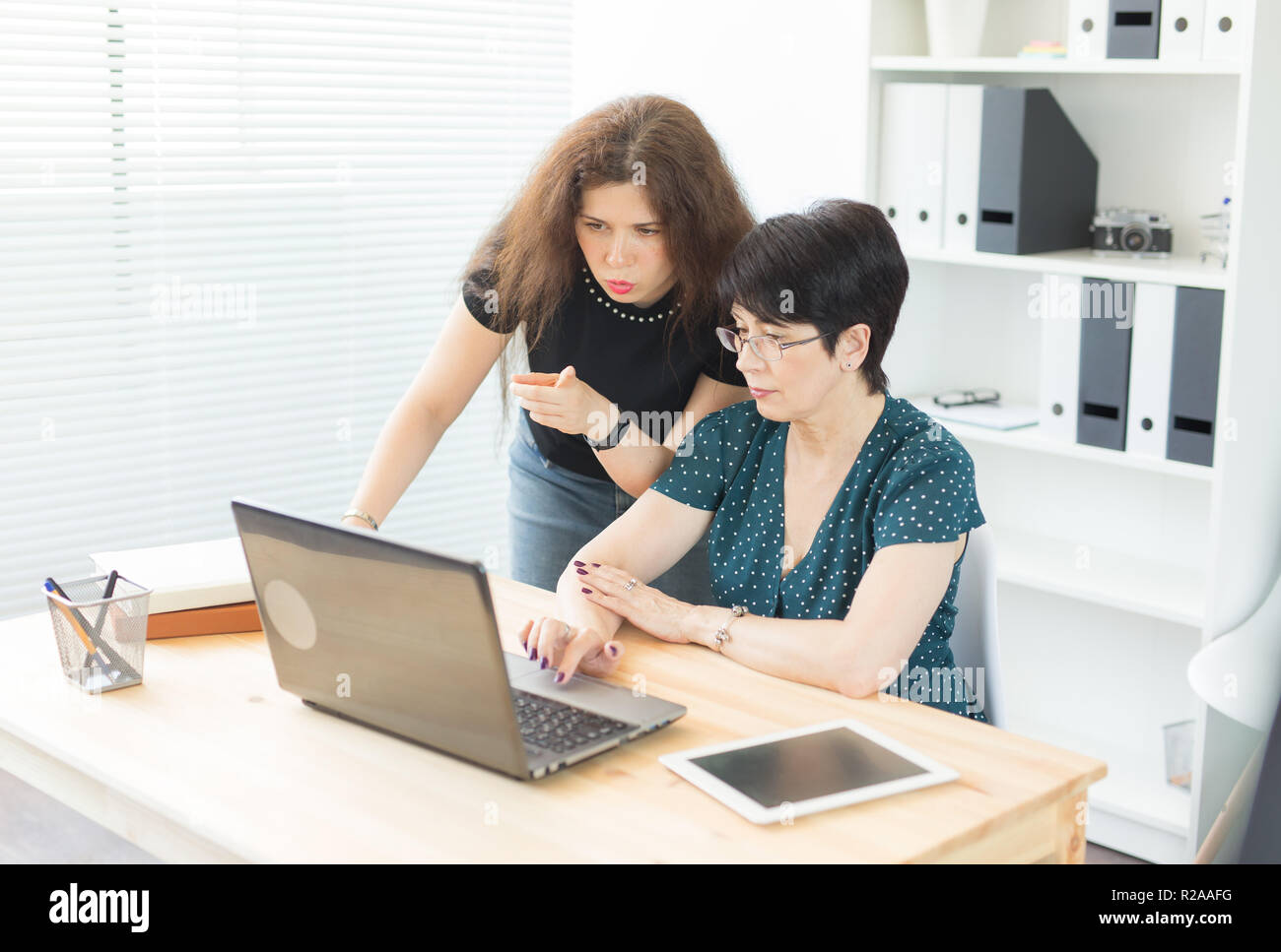 People, technology and communication concept - middle-aged woman and ...