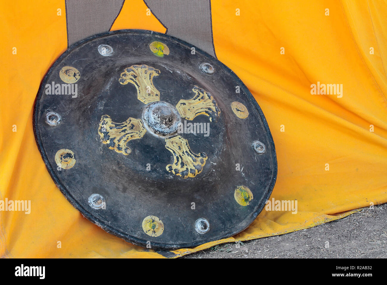 foreground of a medieval shield leaning against the side of a medieval ...