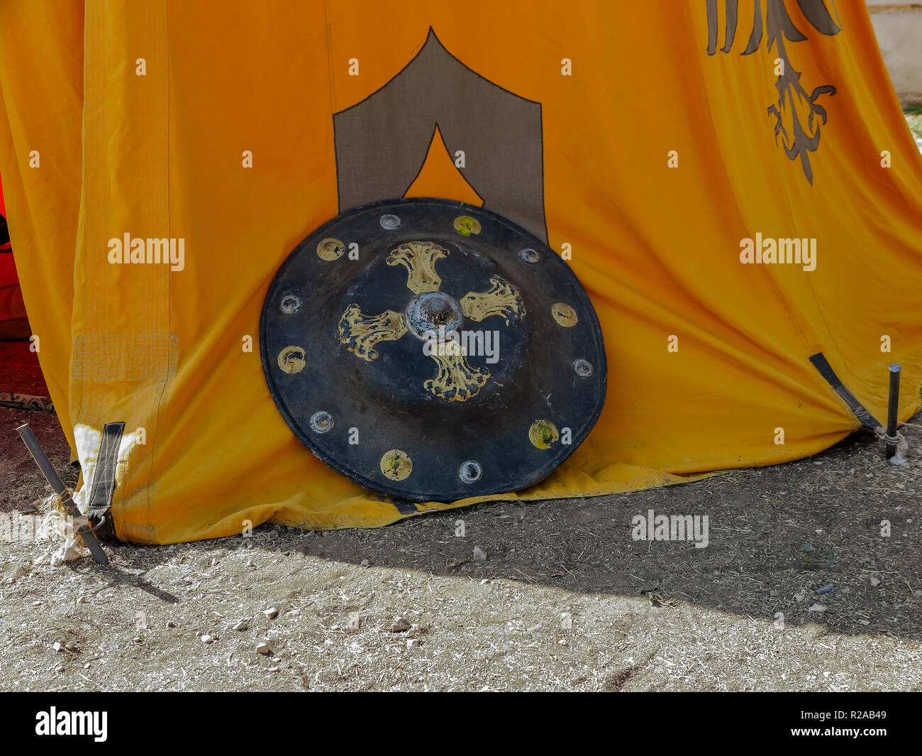 foreground of a medieval shield leaning against the side of a medieval ...