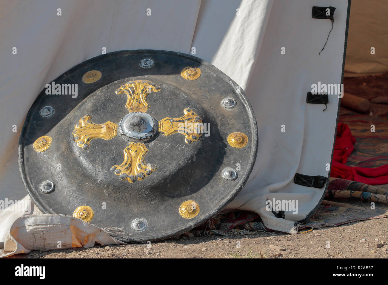 foreground of a medieval shield leaning against the side of a medieval ...