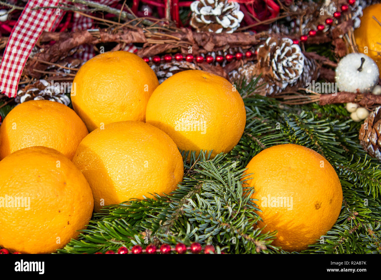 Many Oranges Background with fir cones Stock Photo - Alamy