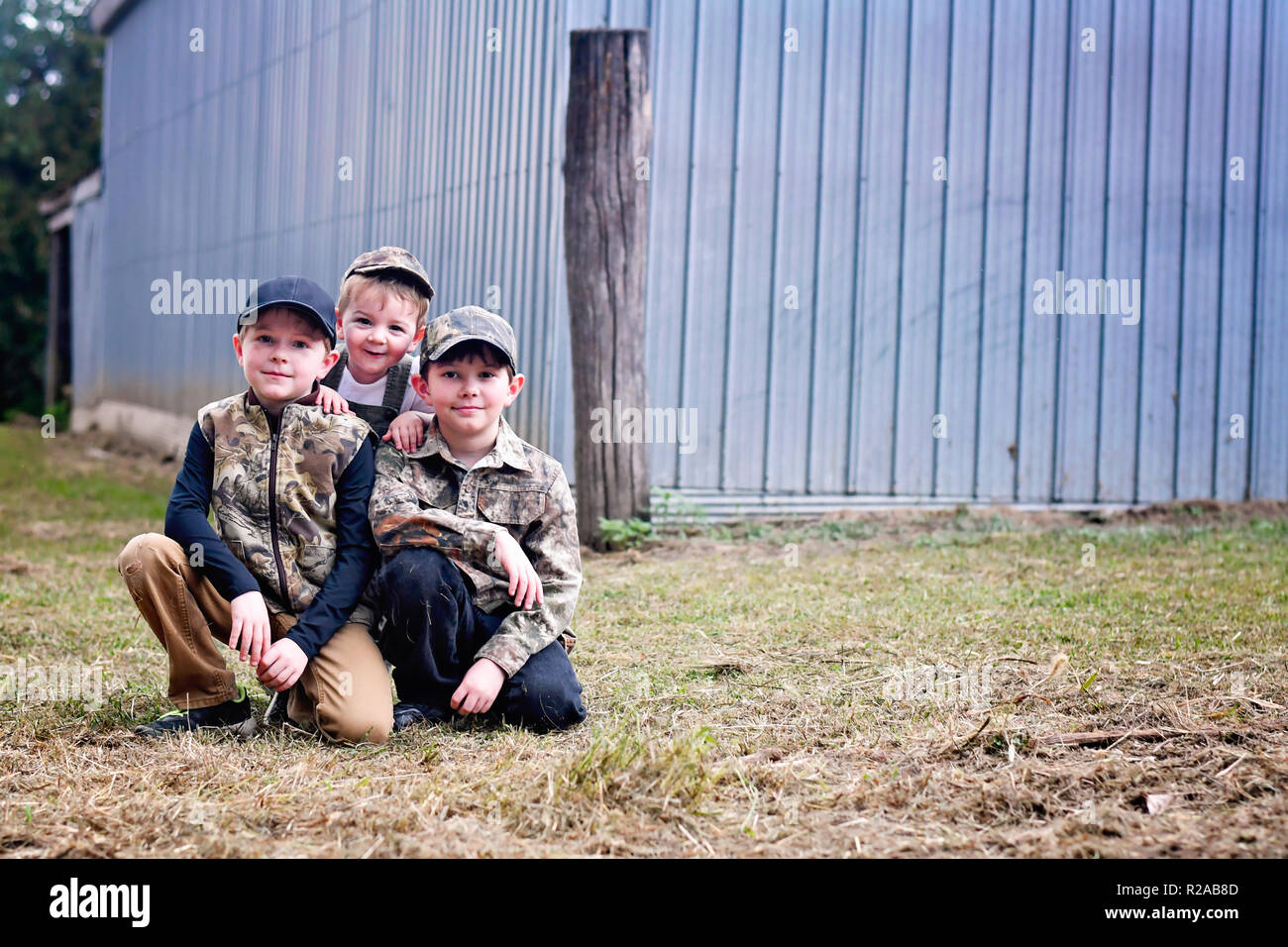 Three brothers together portrait Stock Photo - Alamy