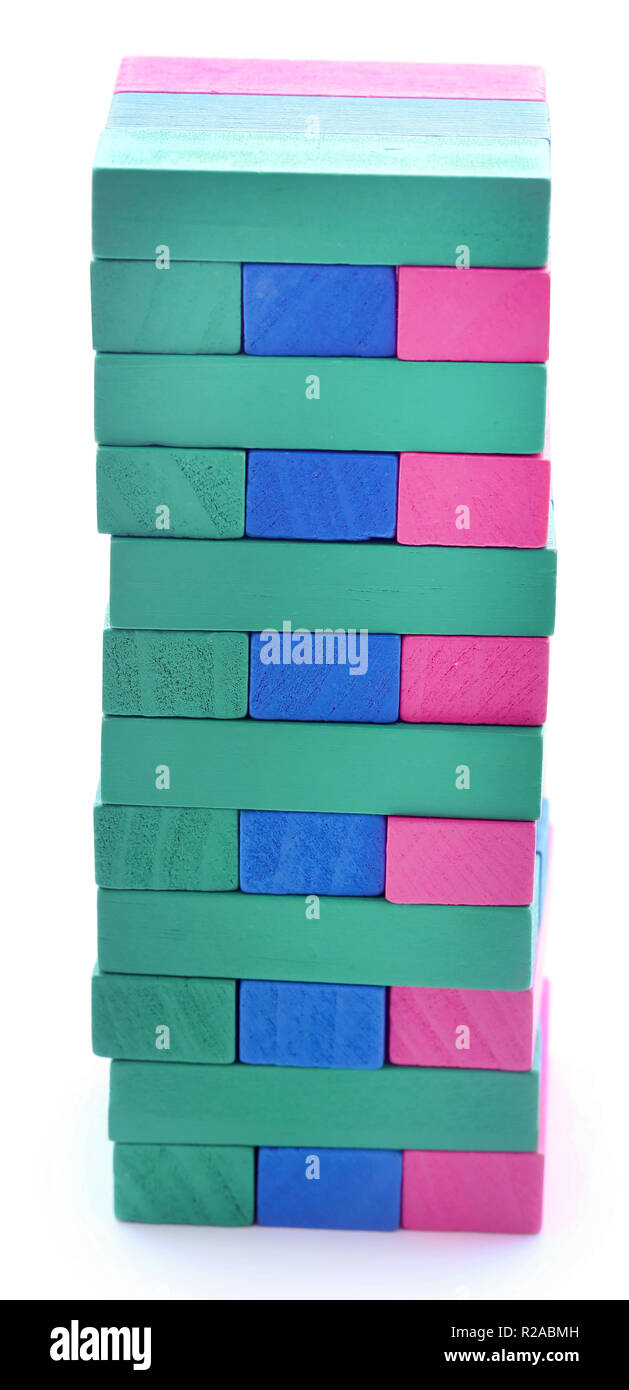 Jenga building of colorful wooden blocks Stock Photo - Alamy