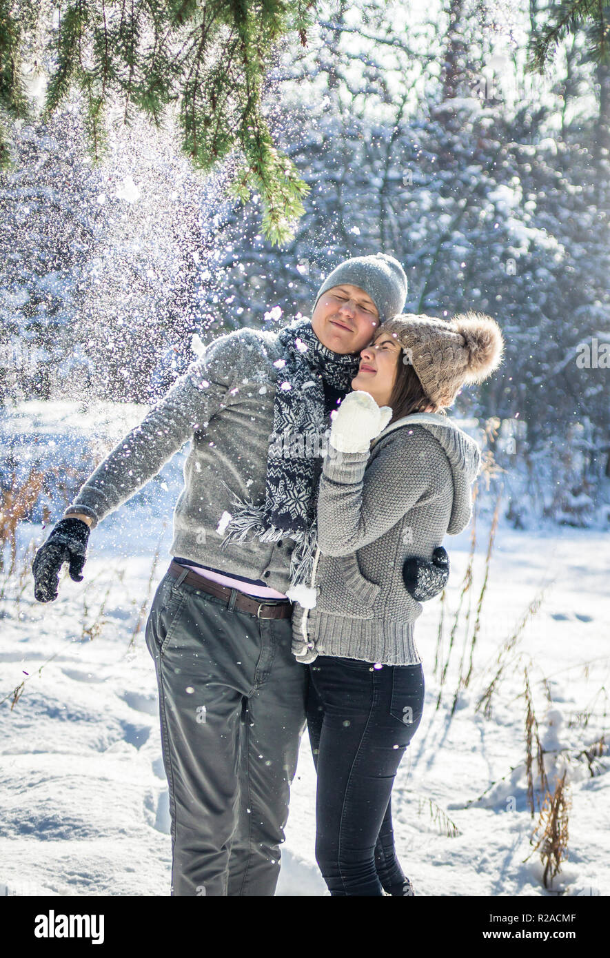 Woman shake snow tree hi-res stock photography and images - Alamy