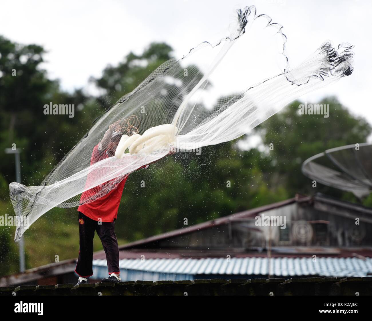 Bandar Seri Begawan, Brunei. 18th Nov, 2018. A fisherman works at the ...