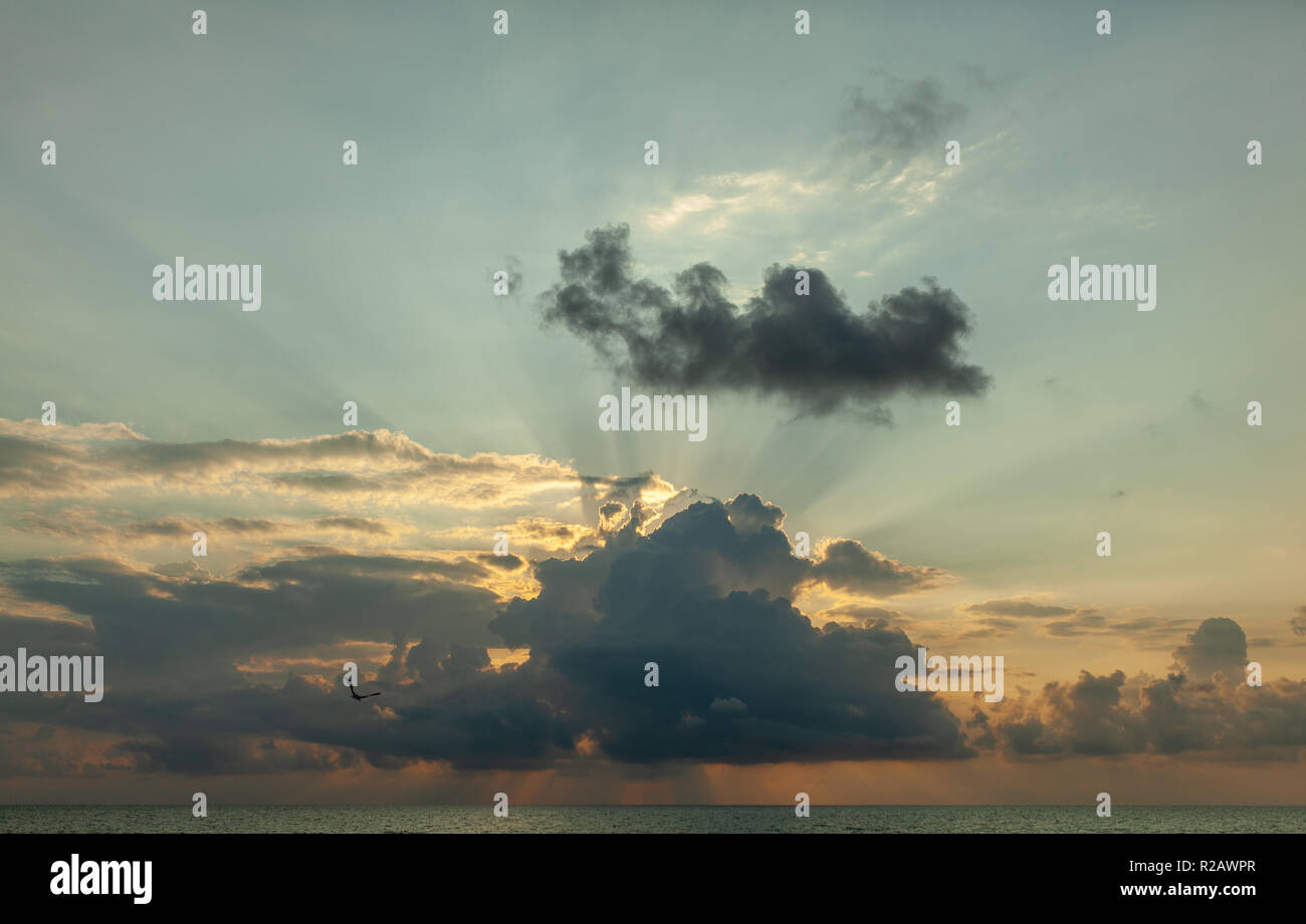 Sunset with clouds, light rays and other atmospheric effect. Dramatic ...