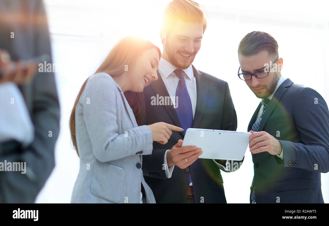 Business people are using gadgets and smiling while working Stock Photo ...