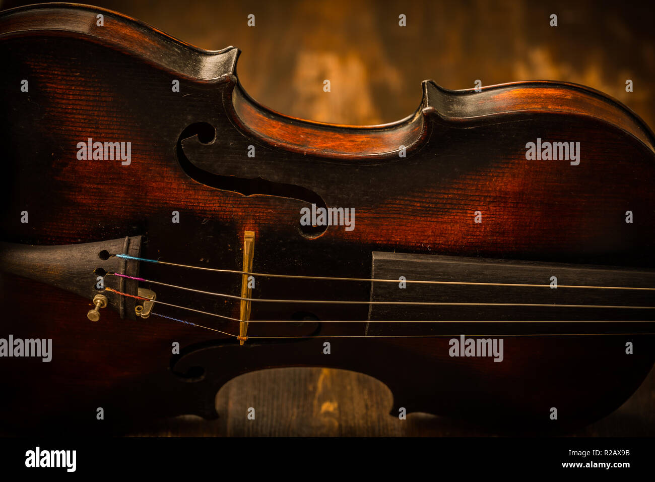 Detail of old violin in vintage style on wood background Stock Photo ...