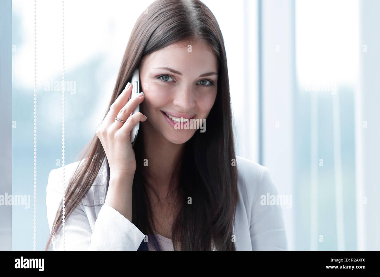 young business woman talking on mobile phone Stock Photo - Alamy