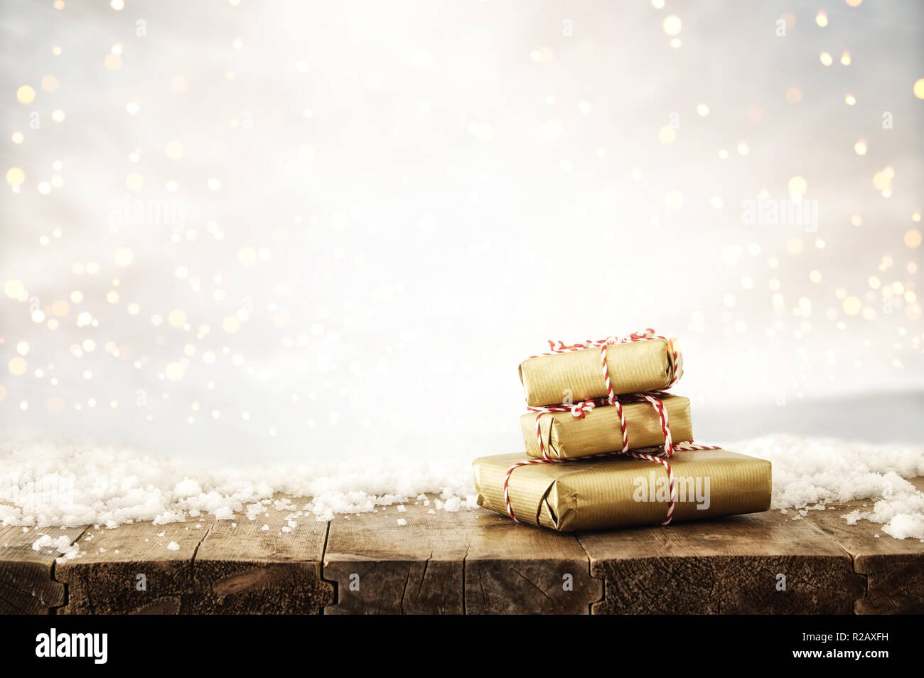 image of handmade wrapped gift boxes over wooden table covered with ...