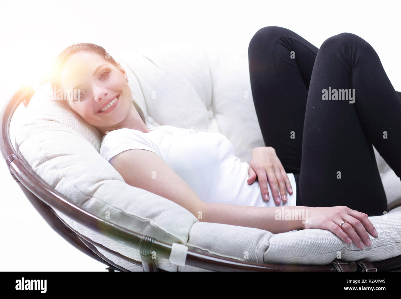 tired woman resting in an easy chair made of rattan Stock Photo - Alamy