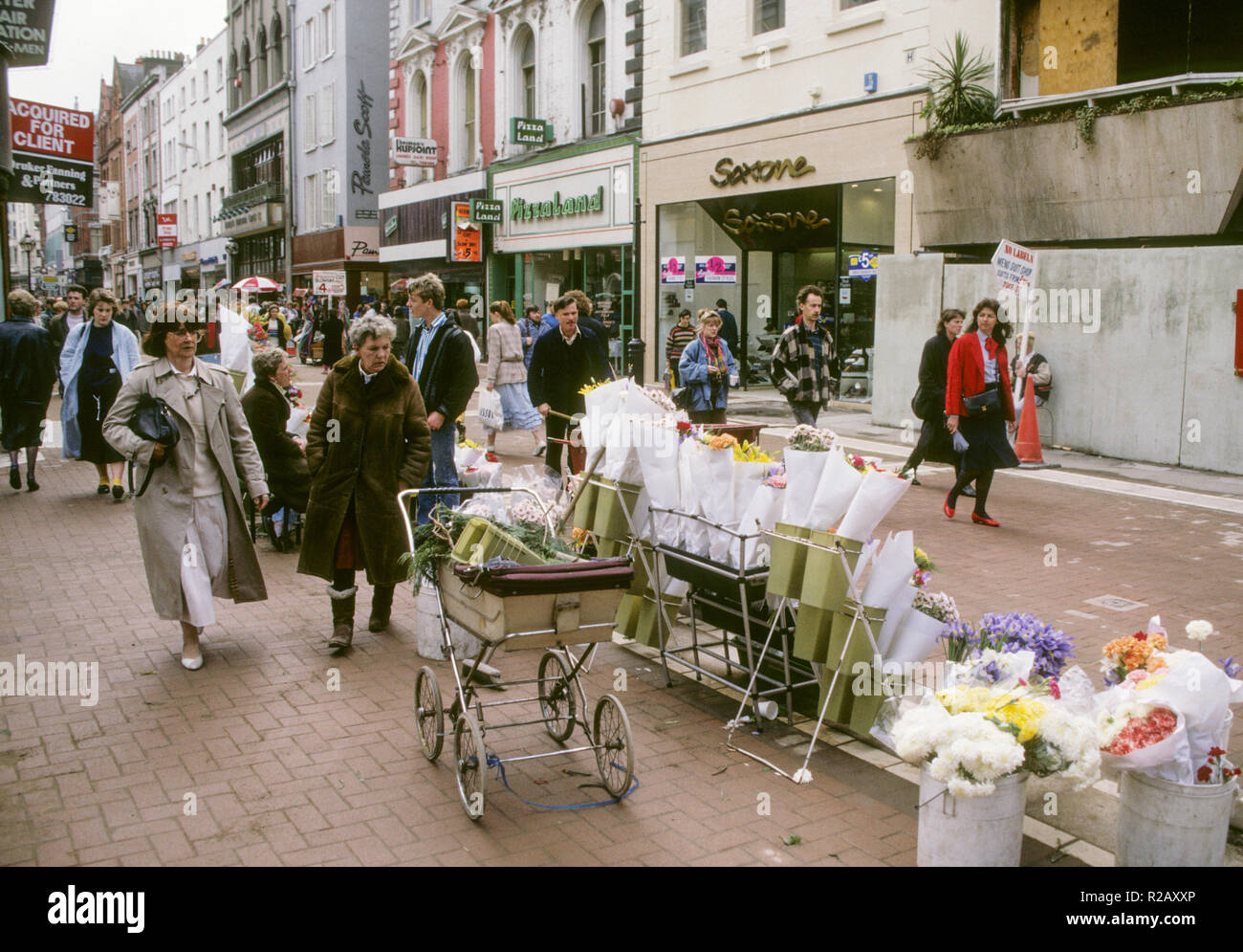 IRELAND Dublin flower vendor with flowers in a pram on the way to the ...
