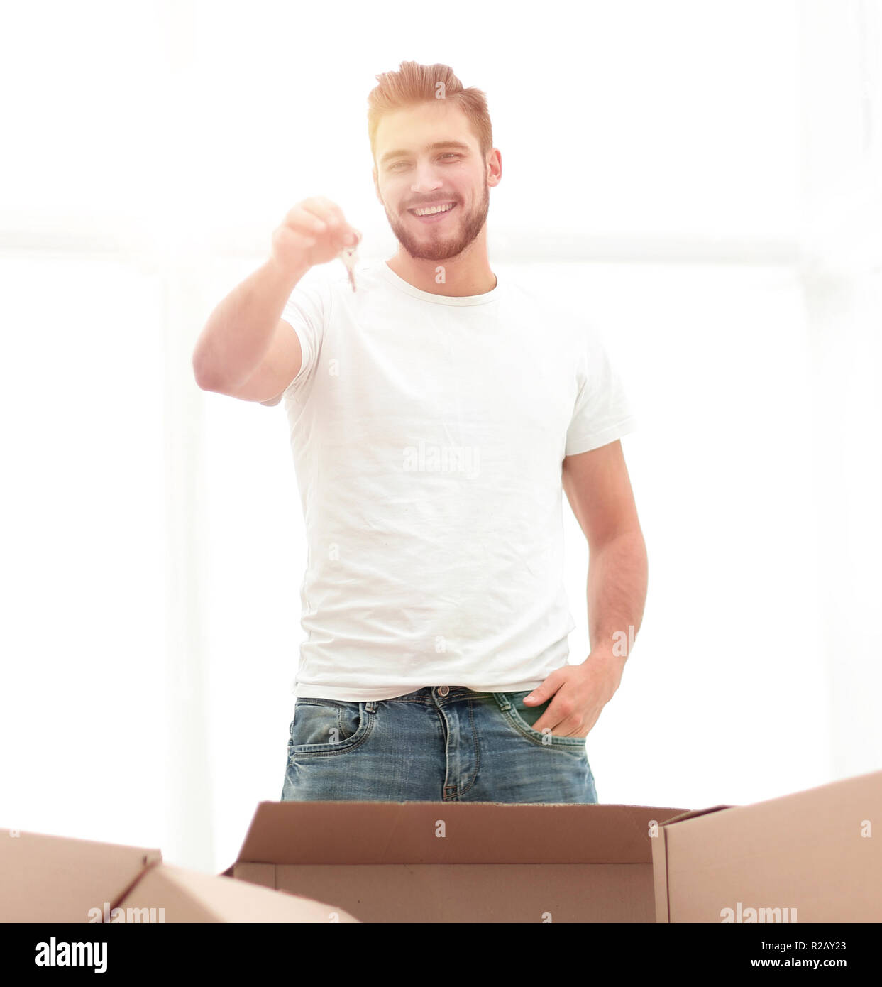 smiling man holding the keys of new apartments Stock Photo - Alamy