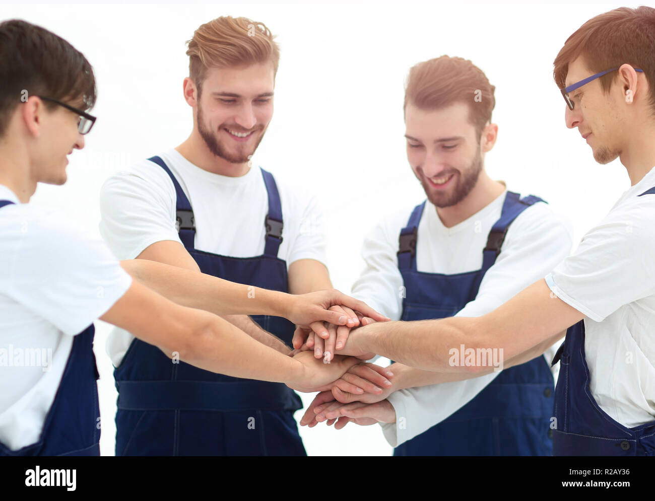 Close up top view of young movers putting their hands together Stock ...
