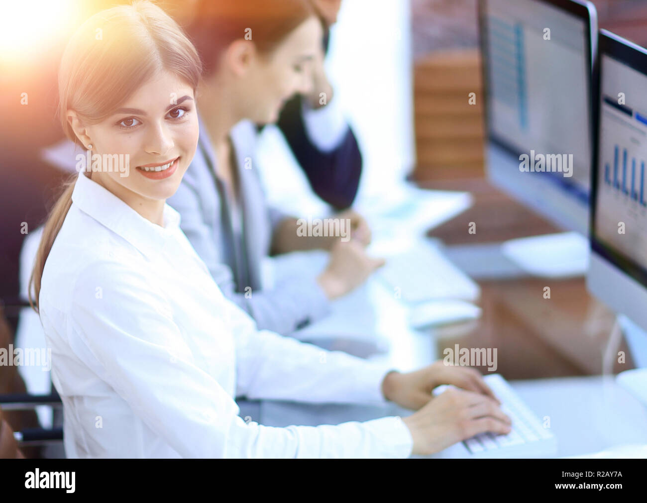young employee sitting at a Desk Stock Photo - Alamy