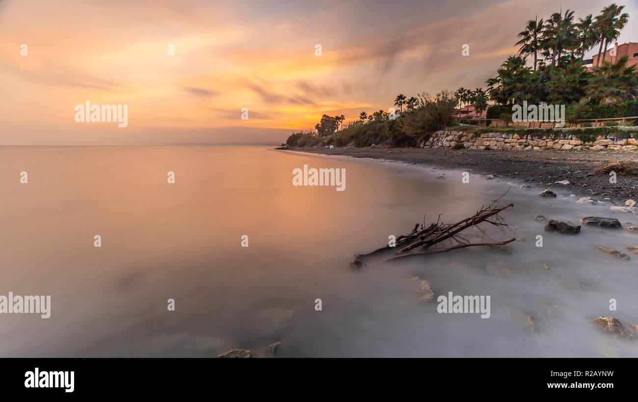 Long Exposure of a beach at sunset Stock Photo - Alamy