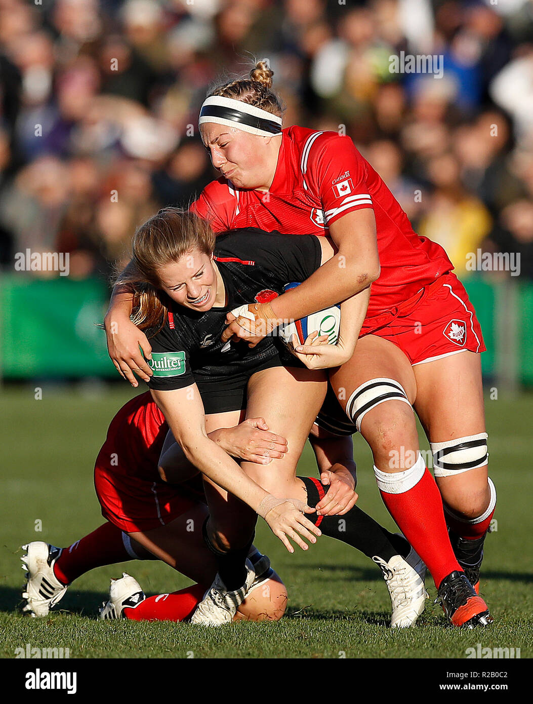 England’s Zoe Harrison is tackled by Canada’s Tyson Beukeboom (left ...
