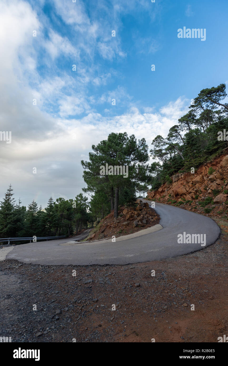 A winding mountain road with serpentine bend Stock Photo - Alamy