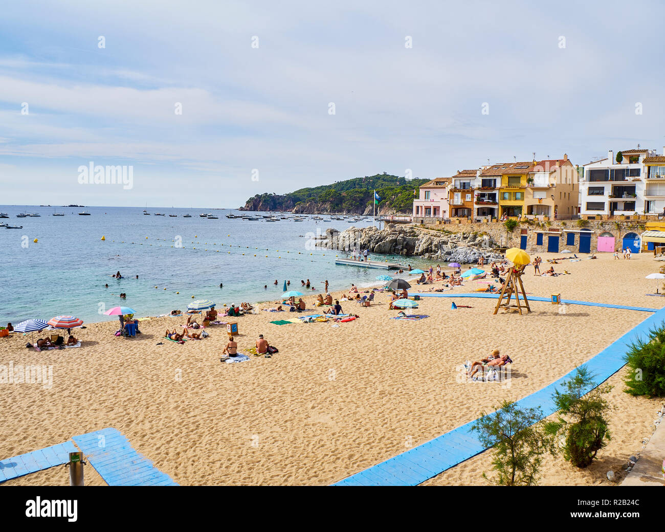 Tourists enjoying a sunbathing in Platja del Canadell, the large beach ...