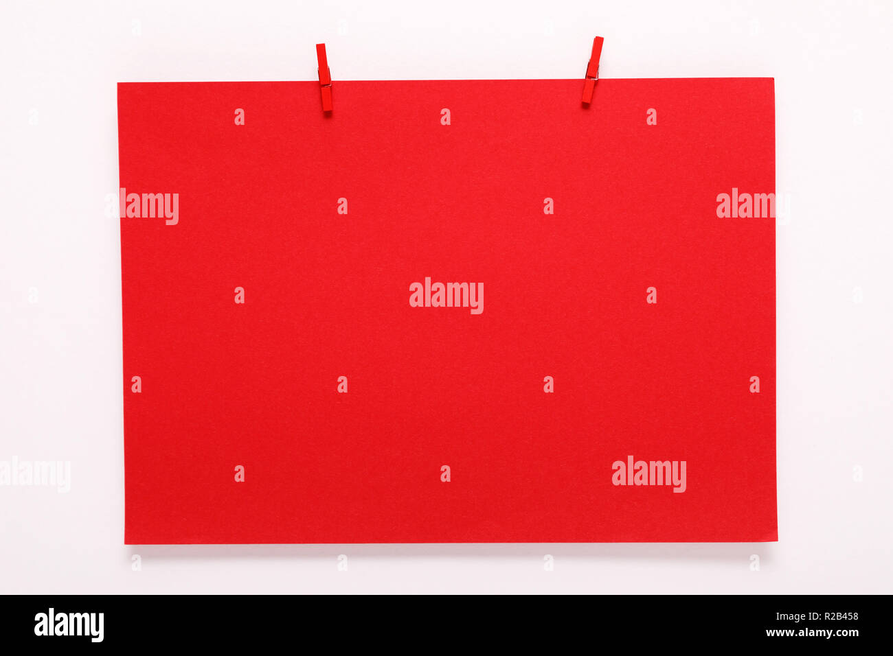 paper card on a clothes peg on a white background Stock Photo - Alamy