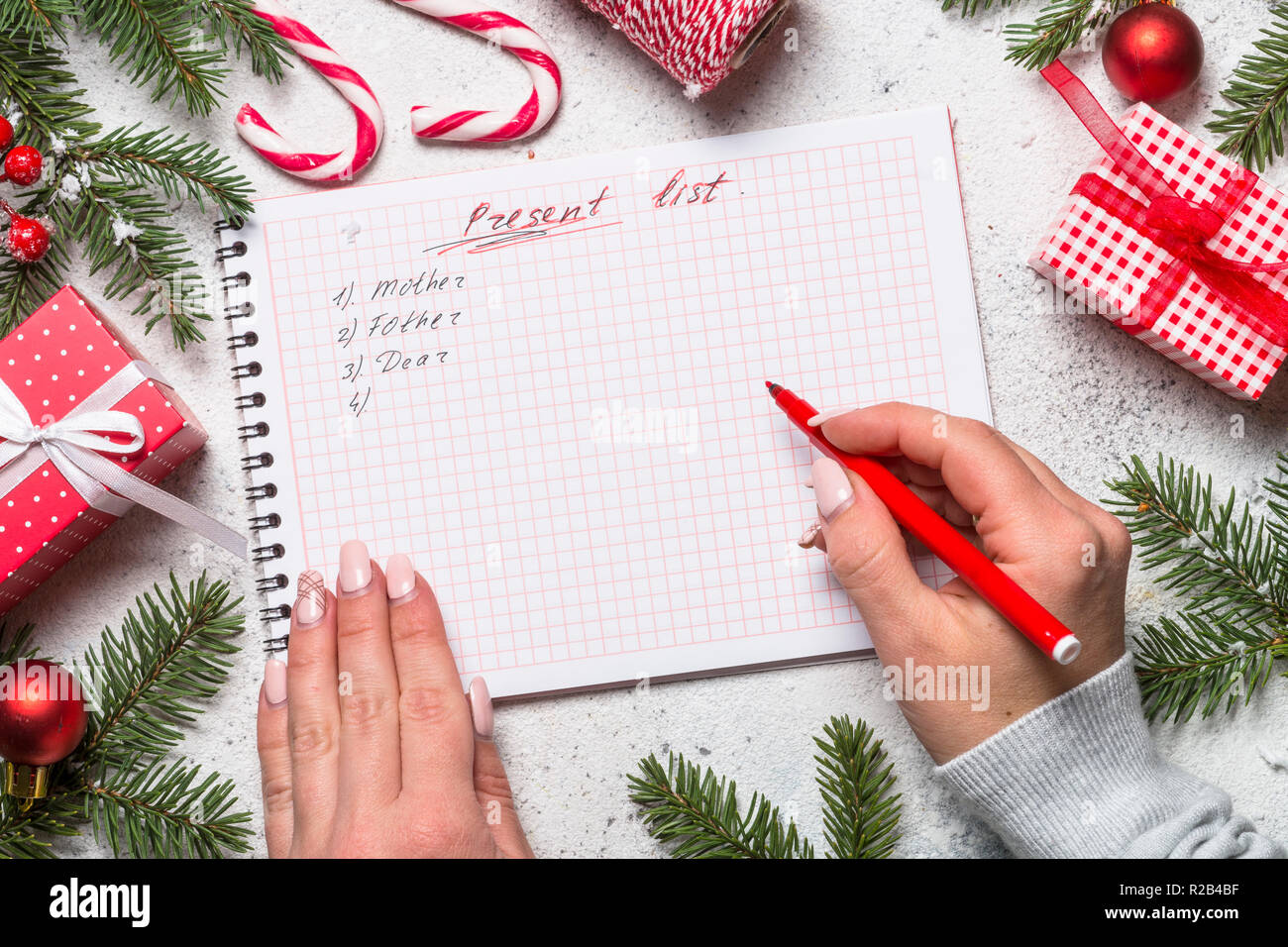 Christmas background with fir tree, candle and decorations on wh Stock ...