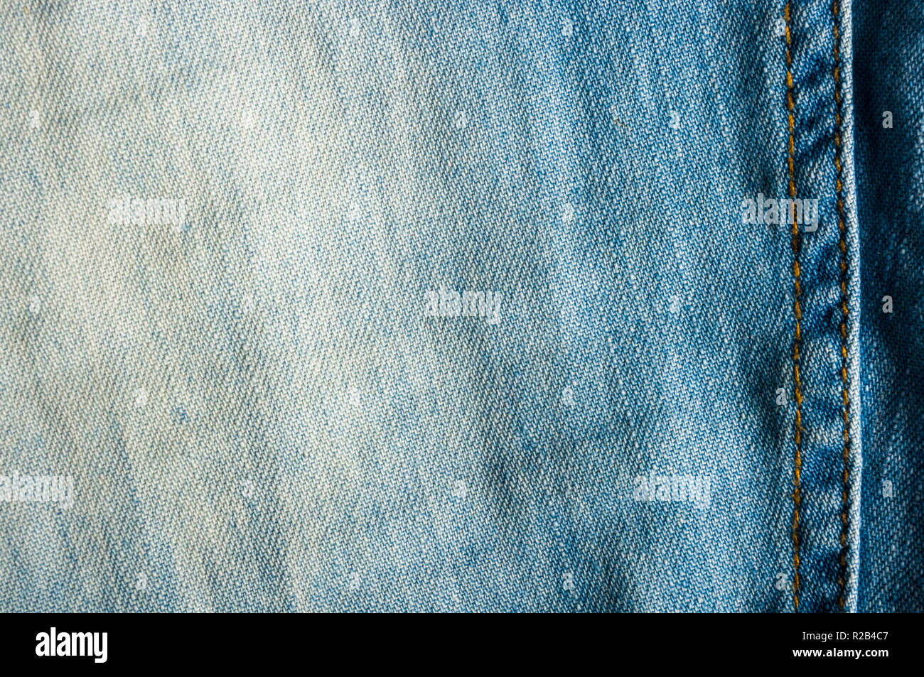 Blue washed faded jeans texture with seams, clothing items, macro ...
